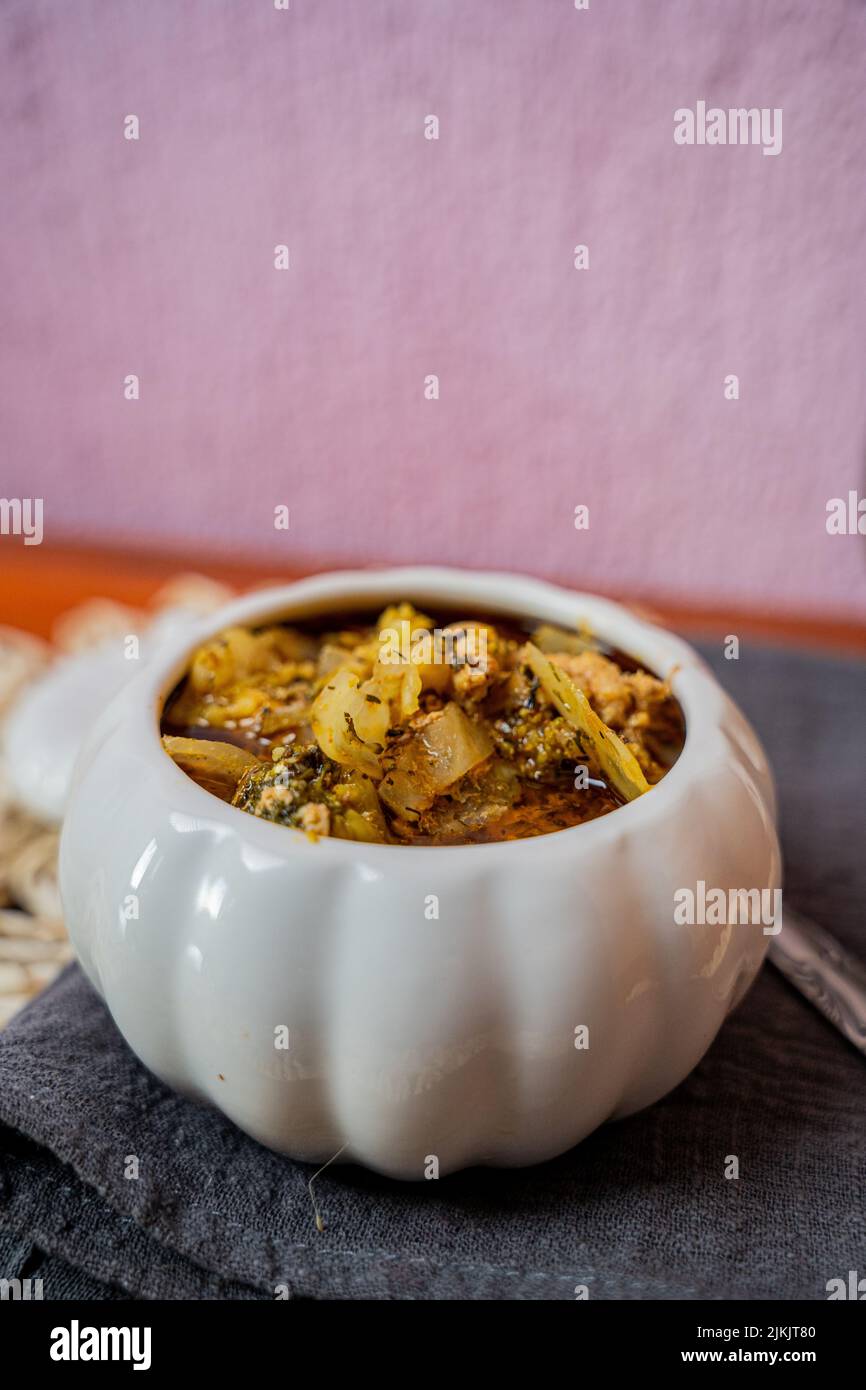 A Shallow focus of a stew soup on a garlic shape white bowl Stock Photo ...