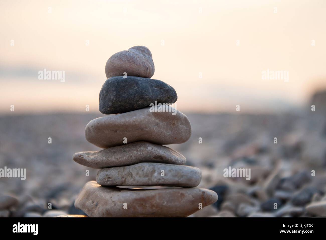 A wallpaper of stones on each other in the beach Stock Photo - Alamy
