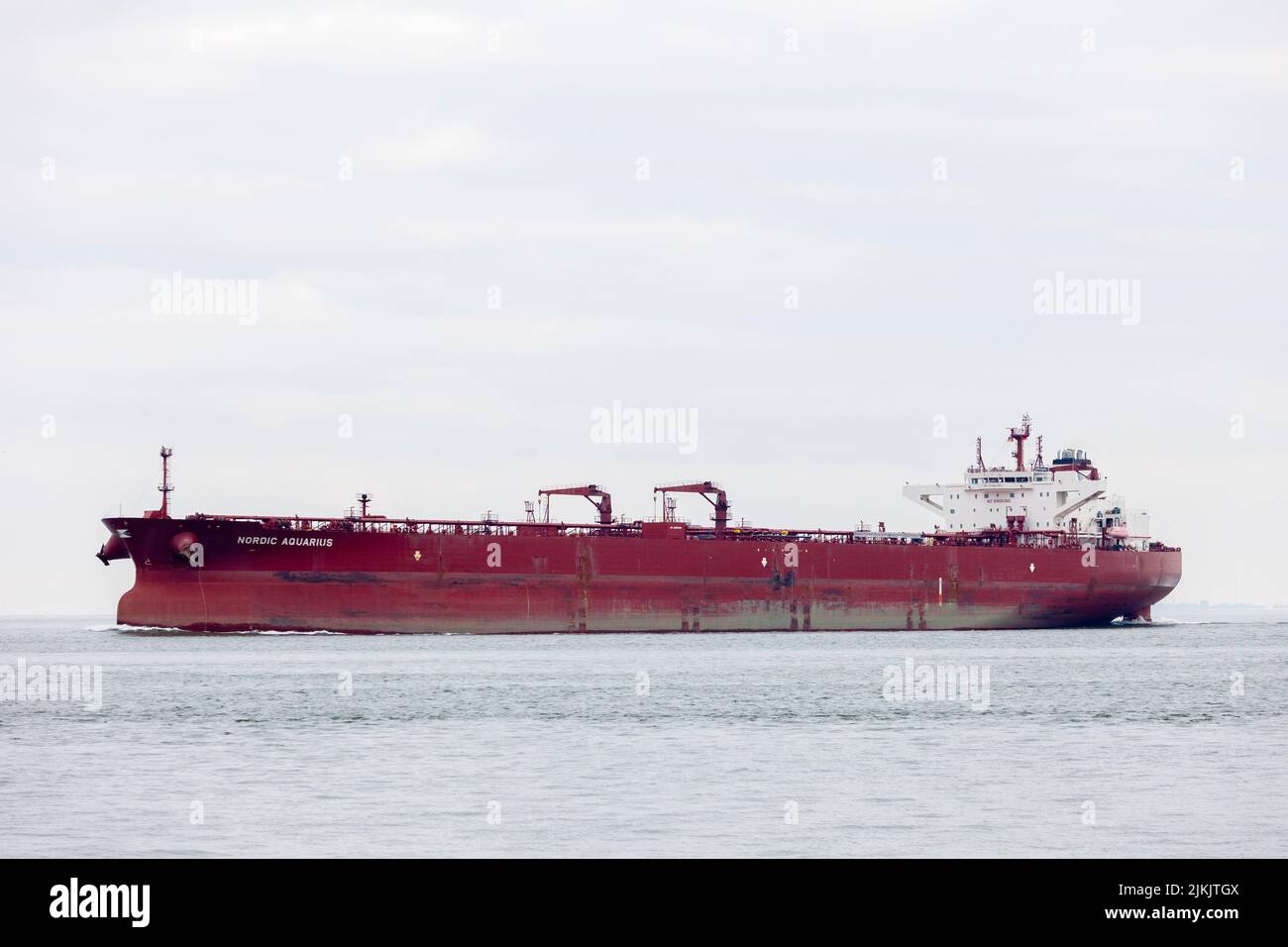 A red tank ship on the river, heading to the North sea Stock Photo - Alamy