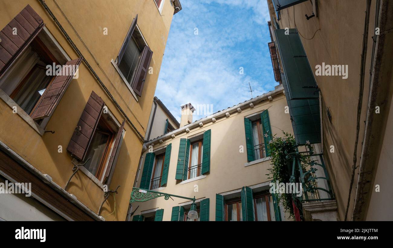 A low angle shot of old picturesque buildings of Venice, the capital of ...
