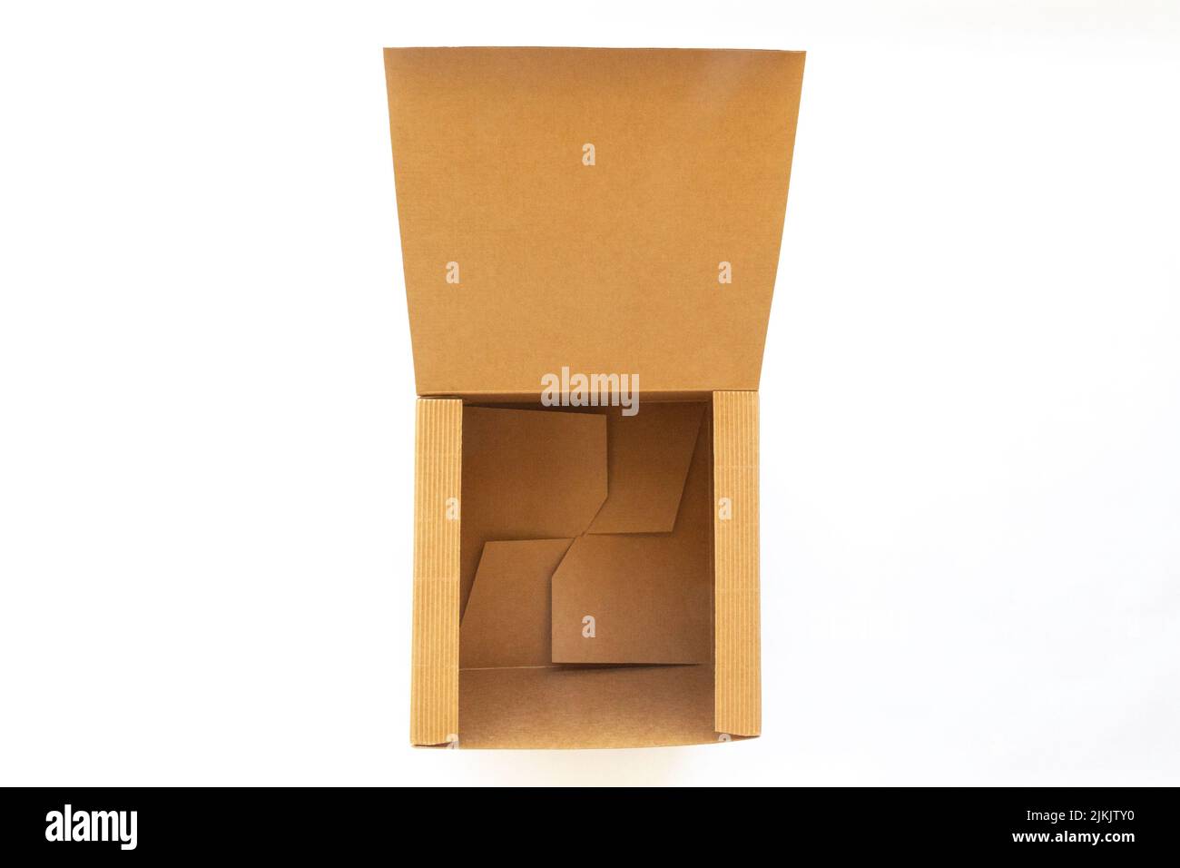 An open brown corrugated kraft cardboard box isolated on white ...