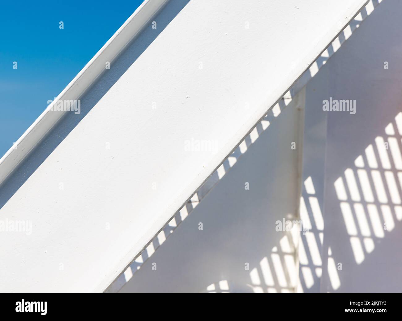 Shadows on painted white metal on a ferry Stock Photo - Alamy