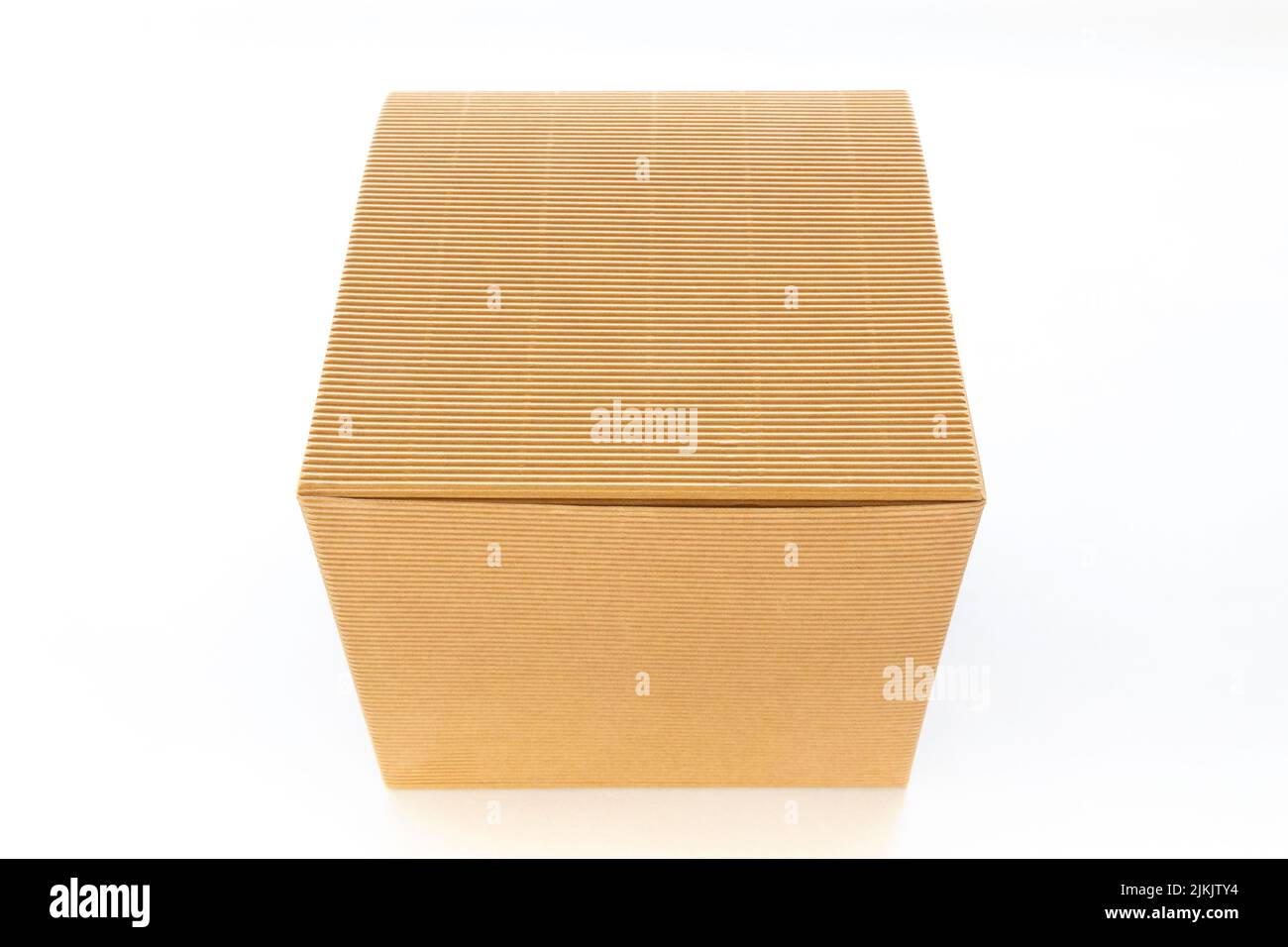 A square corrugated kraft cardboard box isolated on white background ...