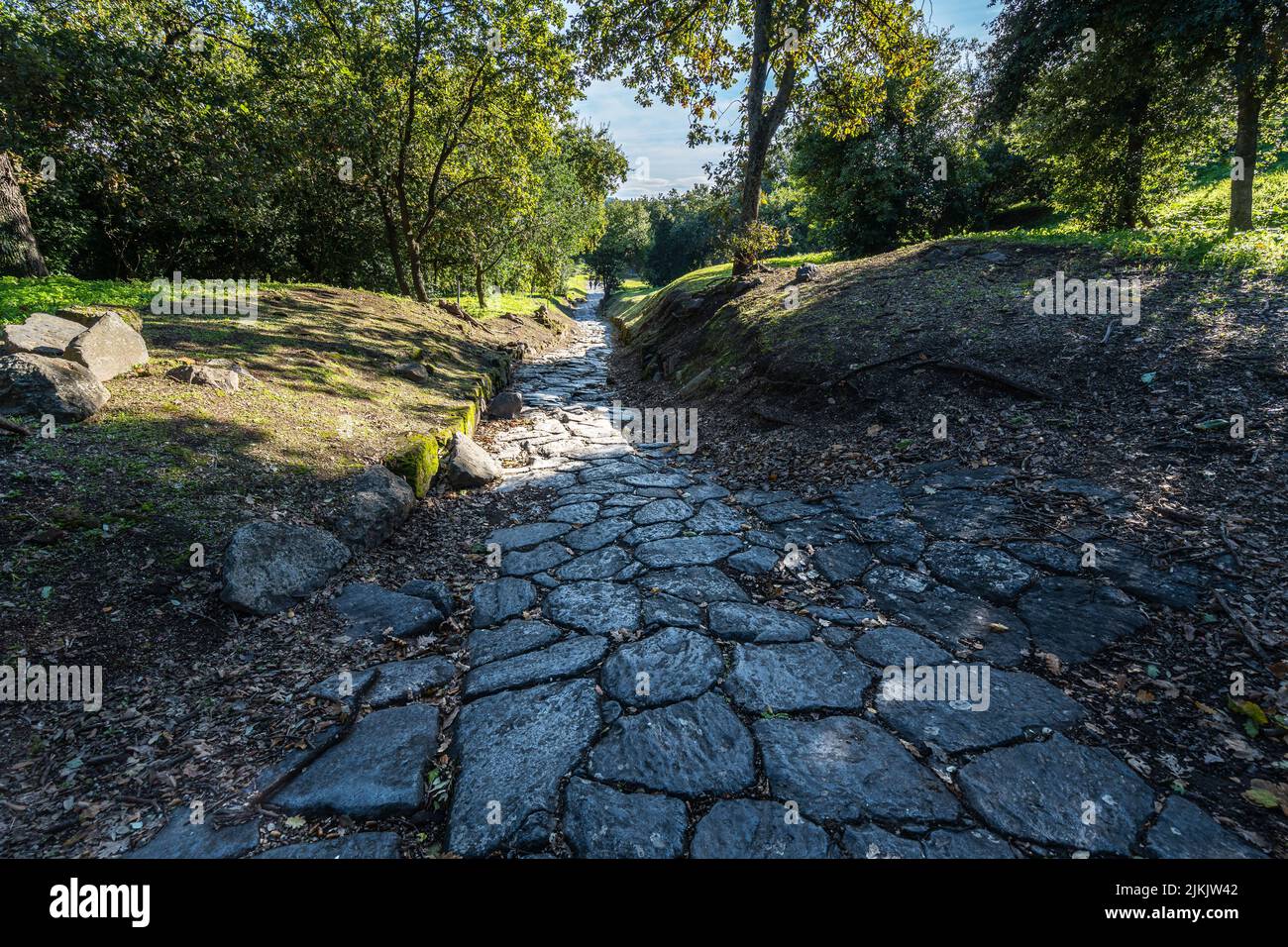 An ancient cobbled street in the Roman city of Cumae at Cumae ...
