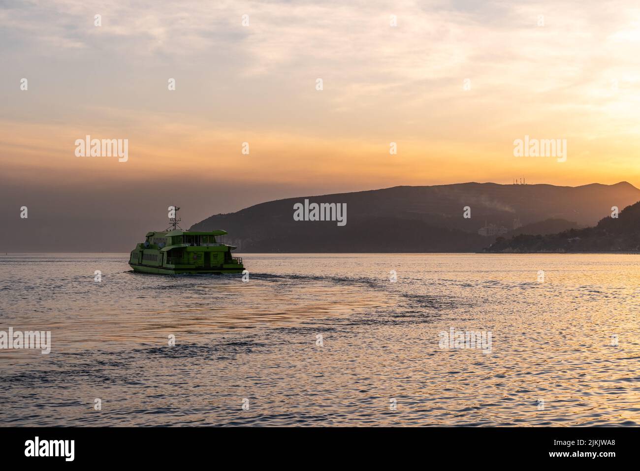 A scenic view of the Atlantic ferry sailing to the port of Setubal at ...