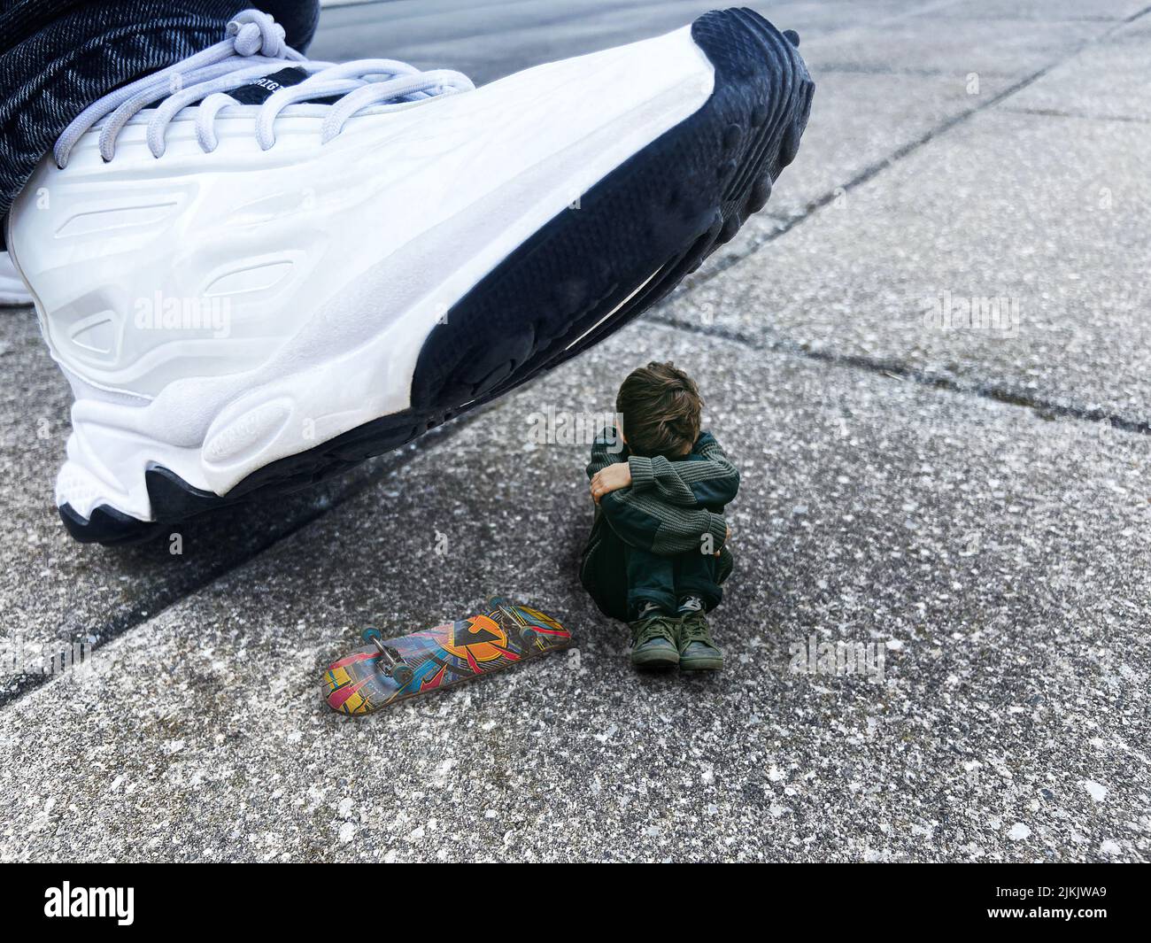 A closeup concept shot of a shore over a little scared child with a ...