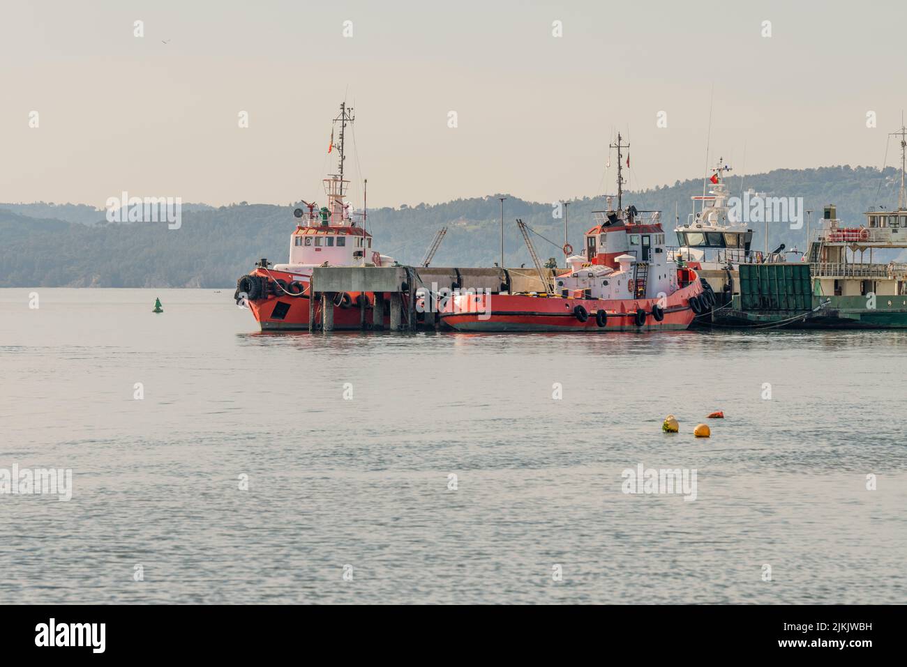 A distant view of the cargo ships in the port of Setubal, Portugal ...