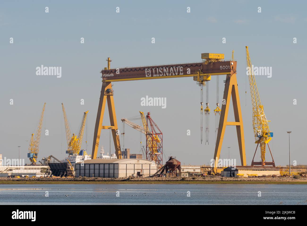 The Lisnave shipyard company with its industrial equipments and cranes ...