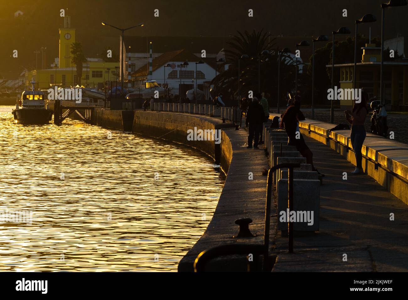 A photo of sunset along the coast of the city of Setubal Stock Photo ...