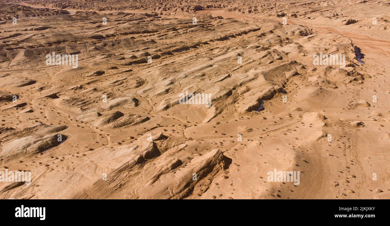 An aerial shot of a wide desert full of yardangs in daylight Stock ...