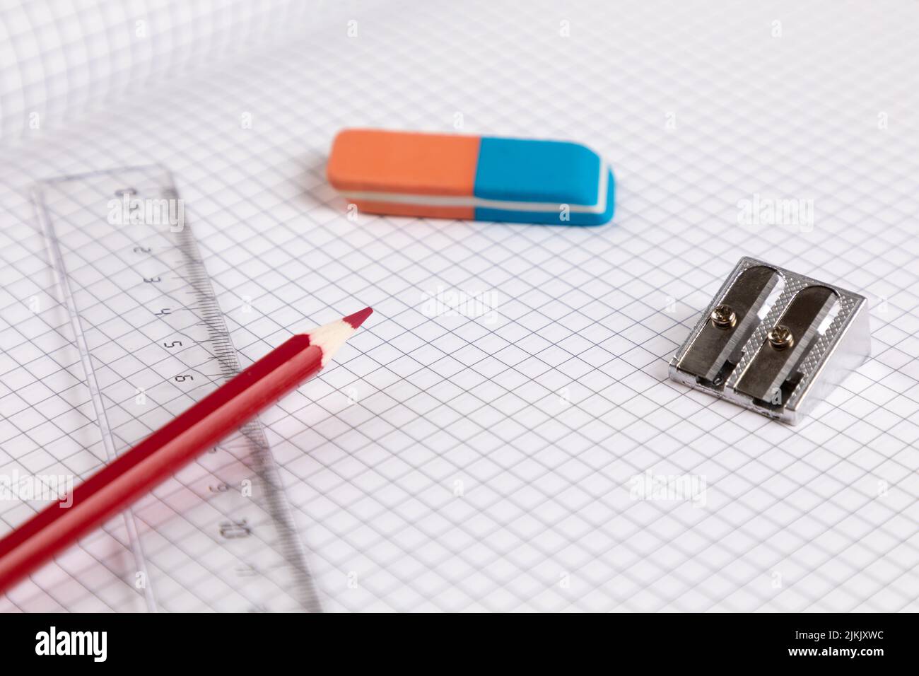 school equipment ruler, eraser with checkered paper Stock Photo - Alamy