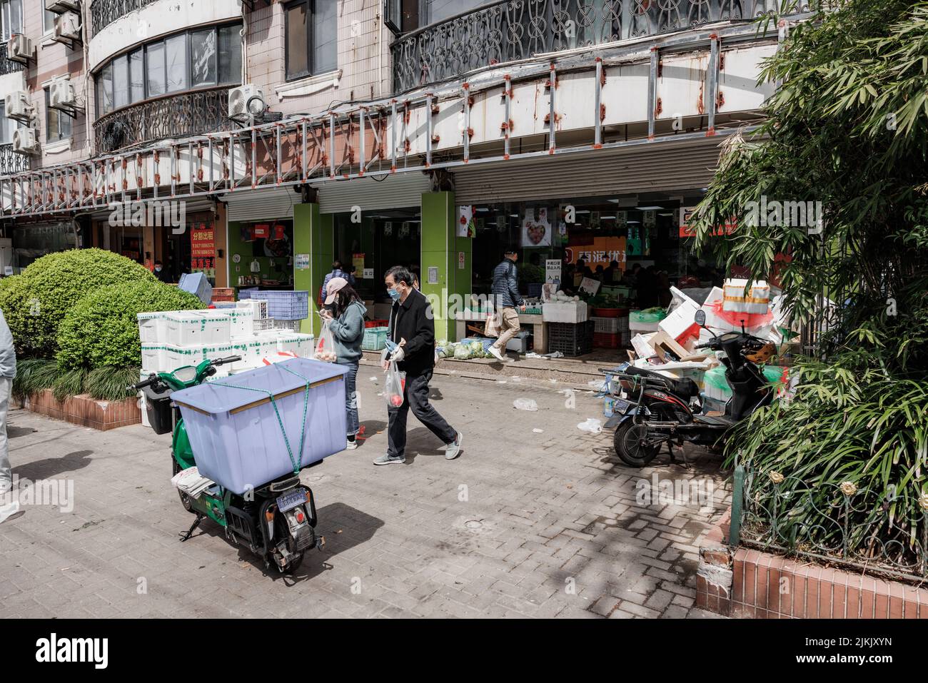 A COVID 19 lockdown preparation, people gathering supplies in Shanghai ...