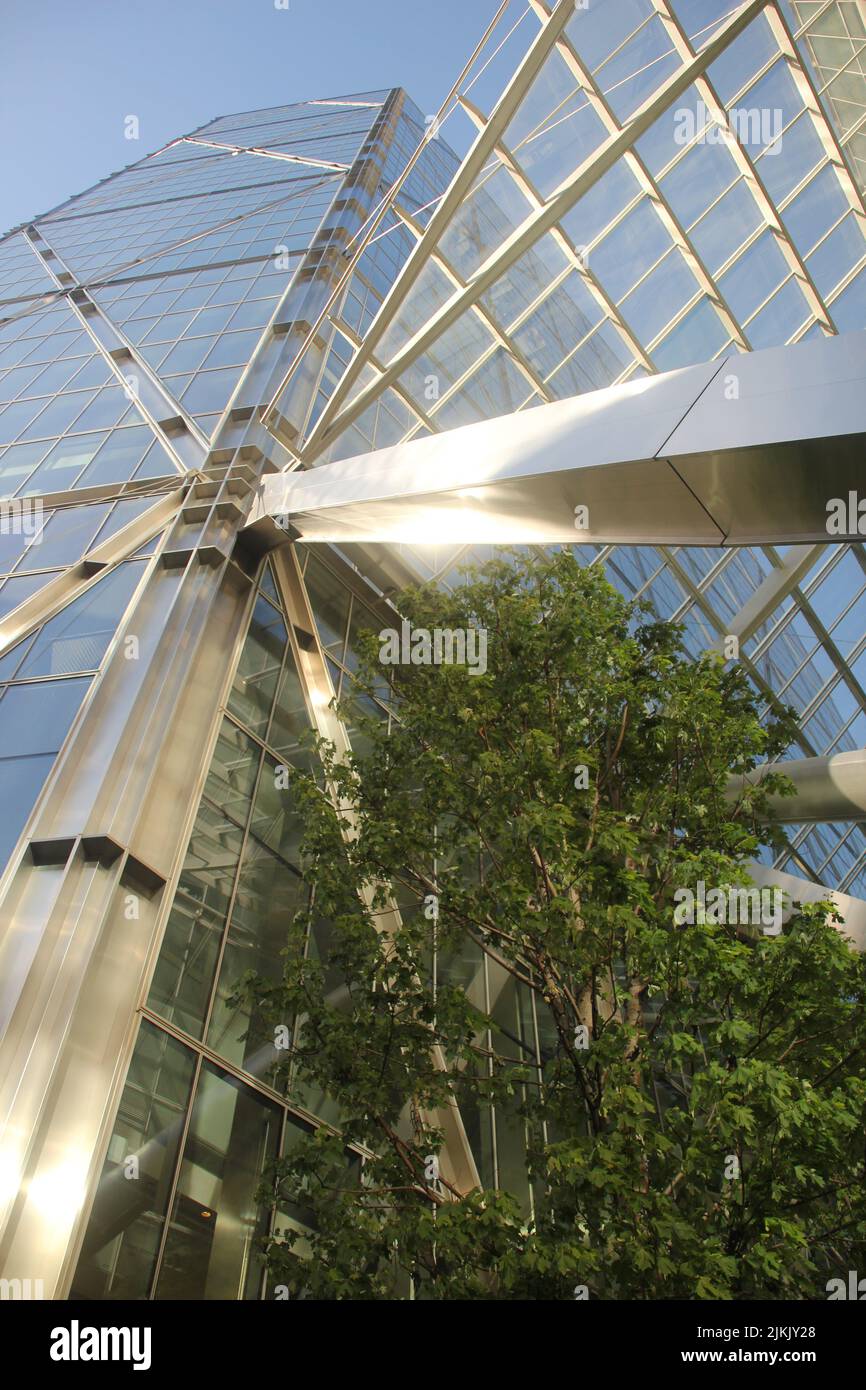 A vertical shot of structural glass panel of a high-rise building Stock ...