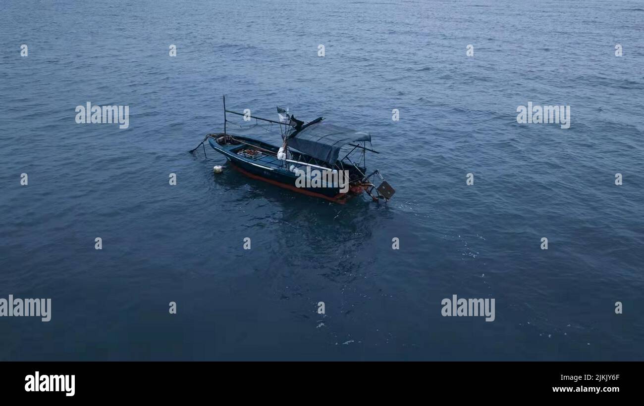 An aerial view of a boat in the blue sea Stock Photo - Alamy