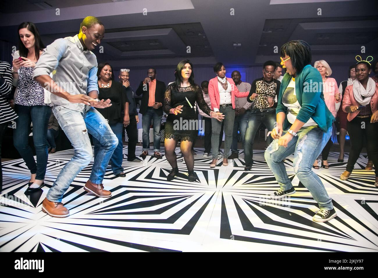 Diverse people dancing on dance floor at party event Stock Photo - Alamy