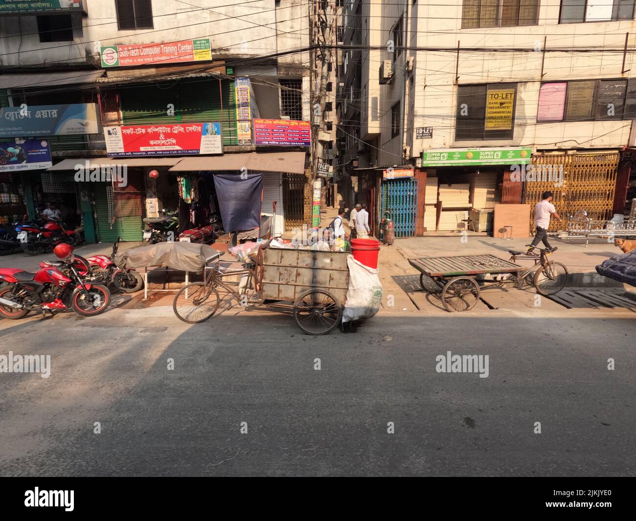 The small stalls with carts along the street in Dhaka, Bangladesh-Daily life concept Stock Photo ...
