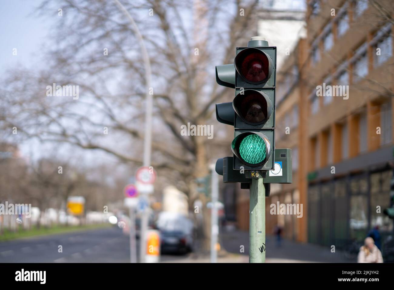 A photo of traffic lights in a city with the green lamp on Stock Photo ...