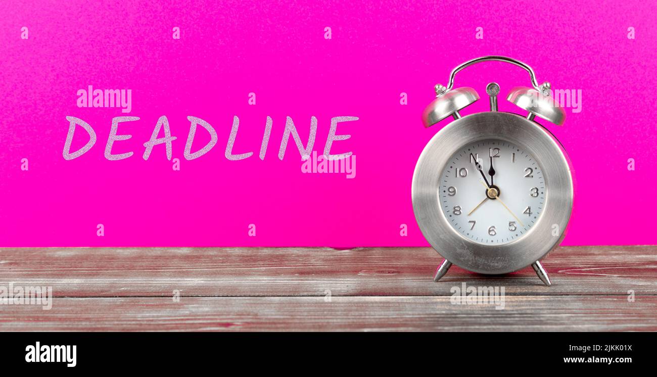 alarm clock with pink background with text english deadline Stock Photo ...