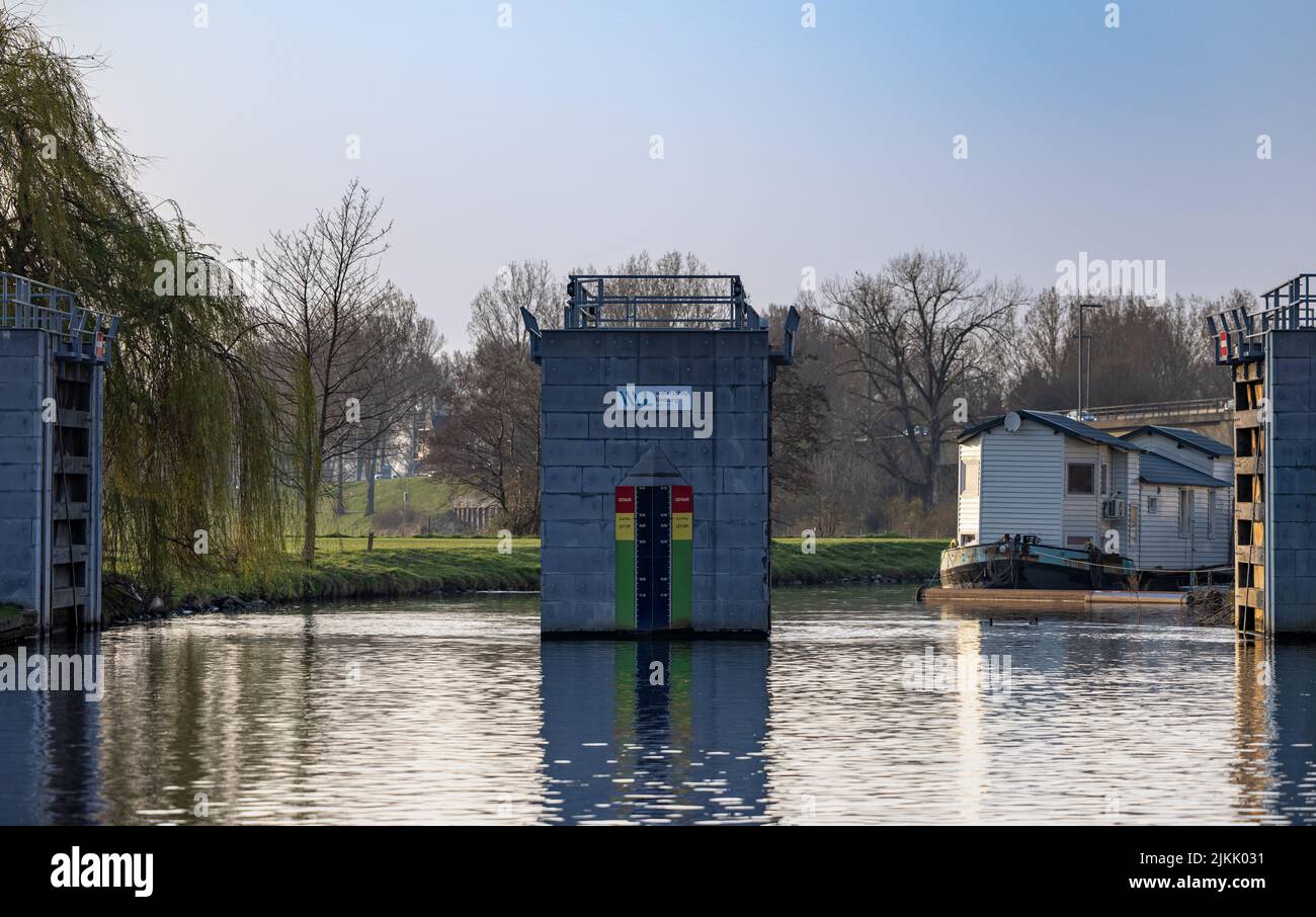 A floodgate in Roermond, Netherlands holding back the river Maas. With ...