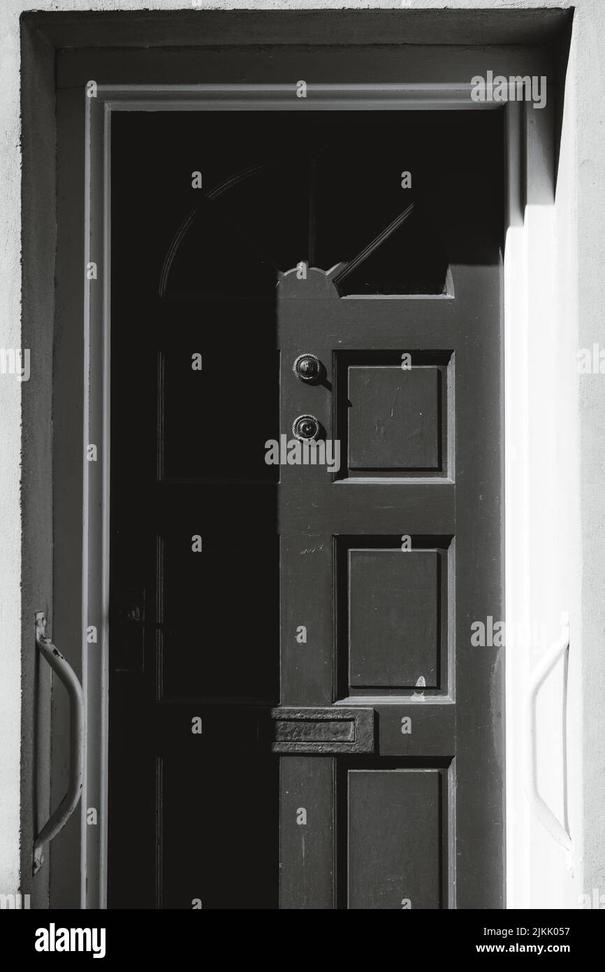 A vertical shot of door under sunlight Stock Photo - Alamy