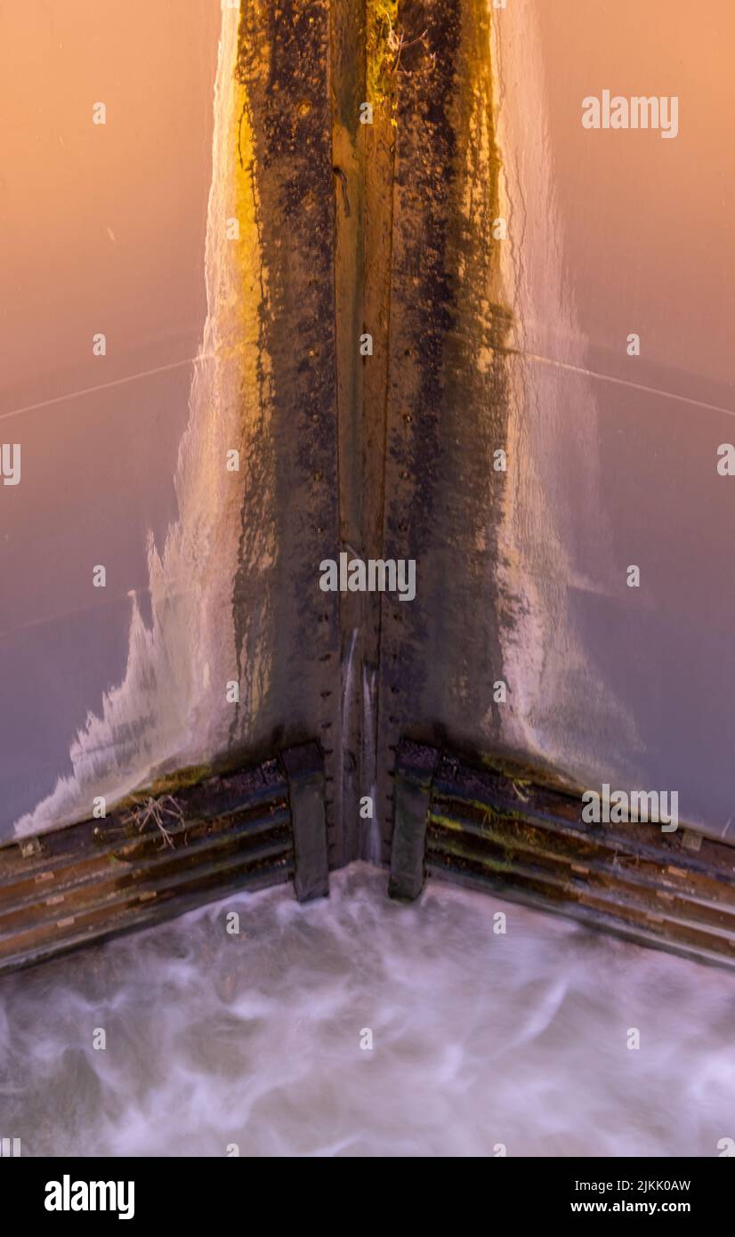 A vertical shot of water going out slowly at one of the biggest sluice ...