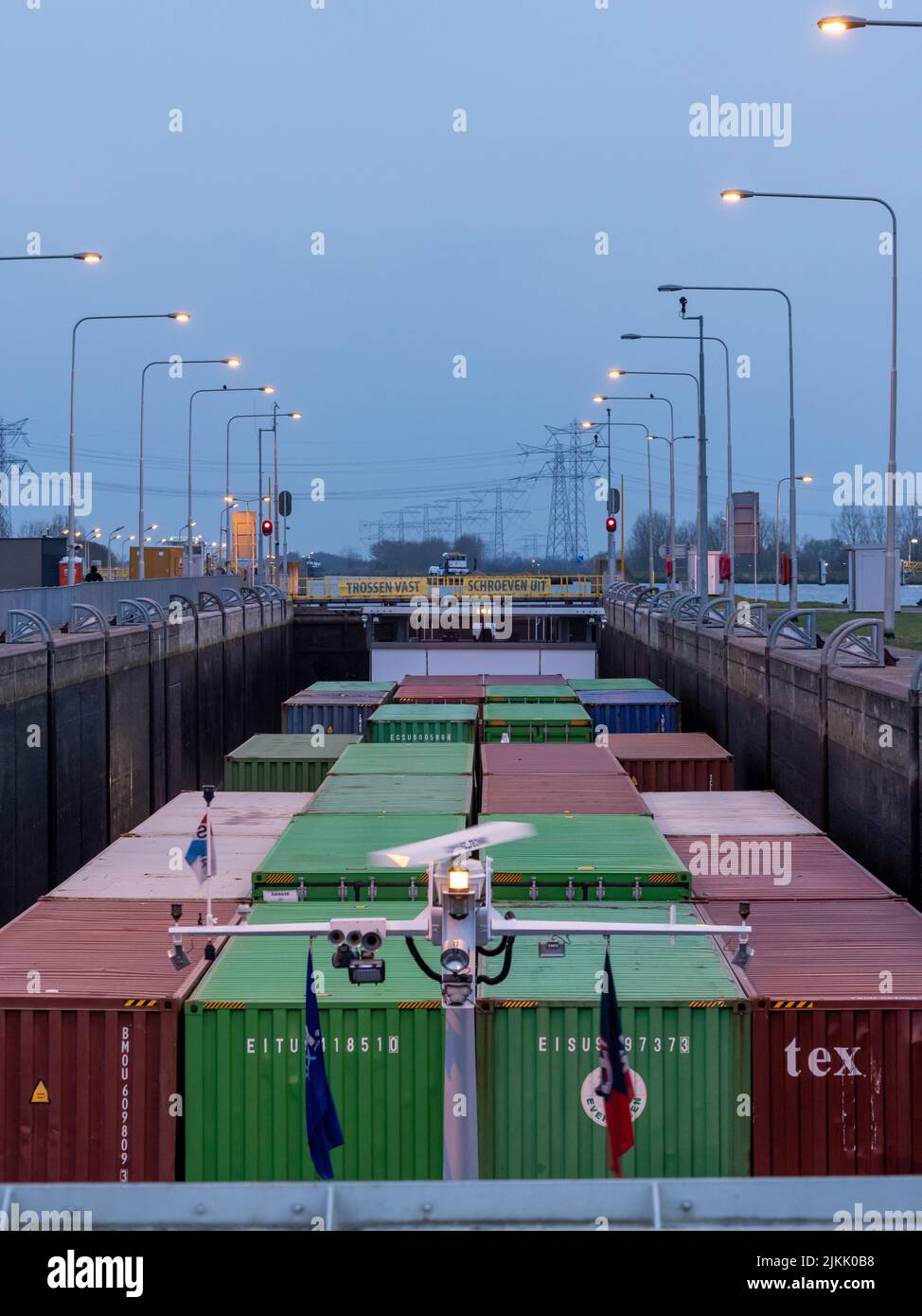 A vertical shot of sluice gates in the Netherlands with a big canal ...
