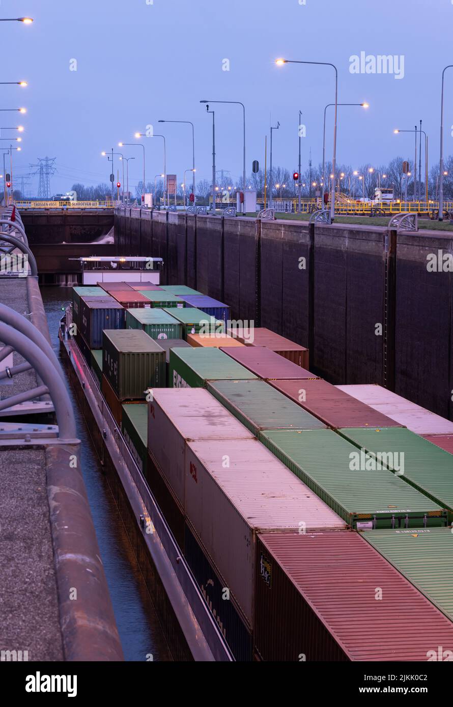 A vertical shot of sluice gates in the Netherlands with a big canal ...