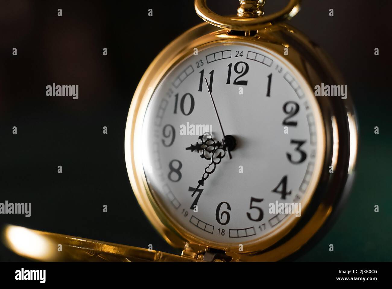 A closeup shot of an old worn pocket watch on a blurry background Stock ...
