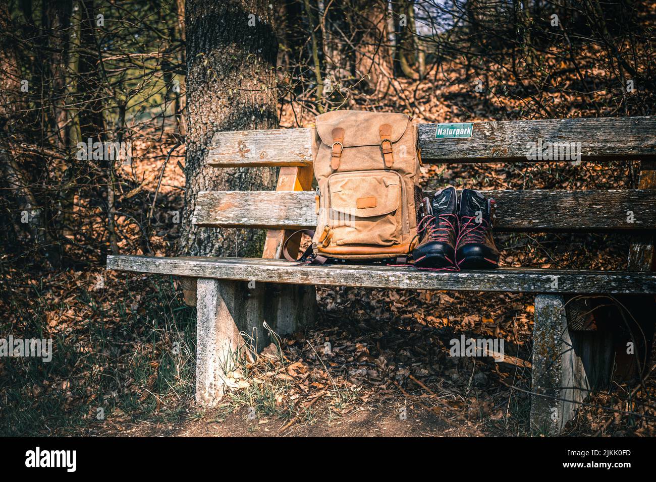 Retro backpack and hiking boots in nature. hiking gear Stock Photo - Alamy