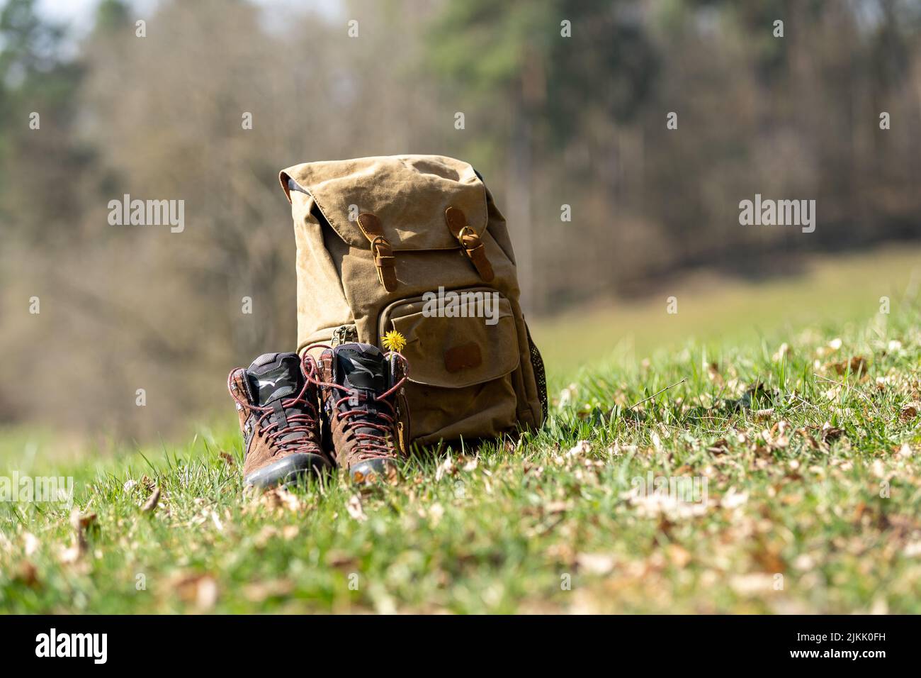 Retro backpack and hiking boots in nature. hiking gear Stock Photo - Alamy