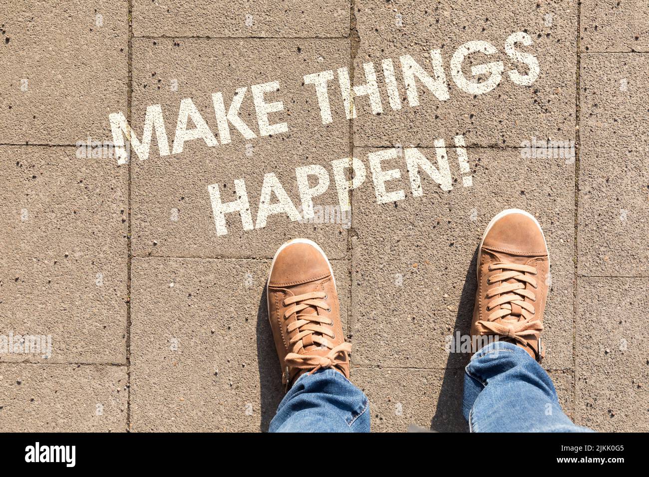 shoes with text make things happen Stock Photo - Alamy