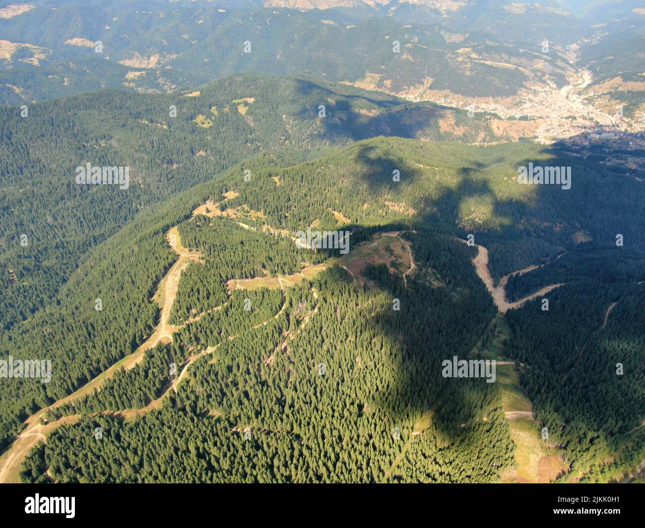 An aerial view of forest fields and countryside in Asenovgrad, Bulgaria ...