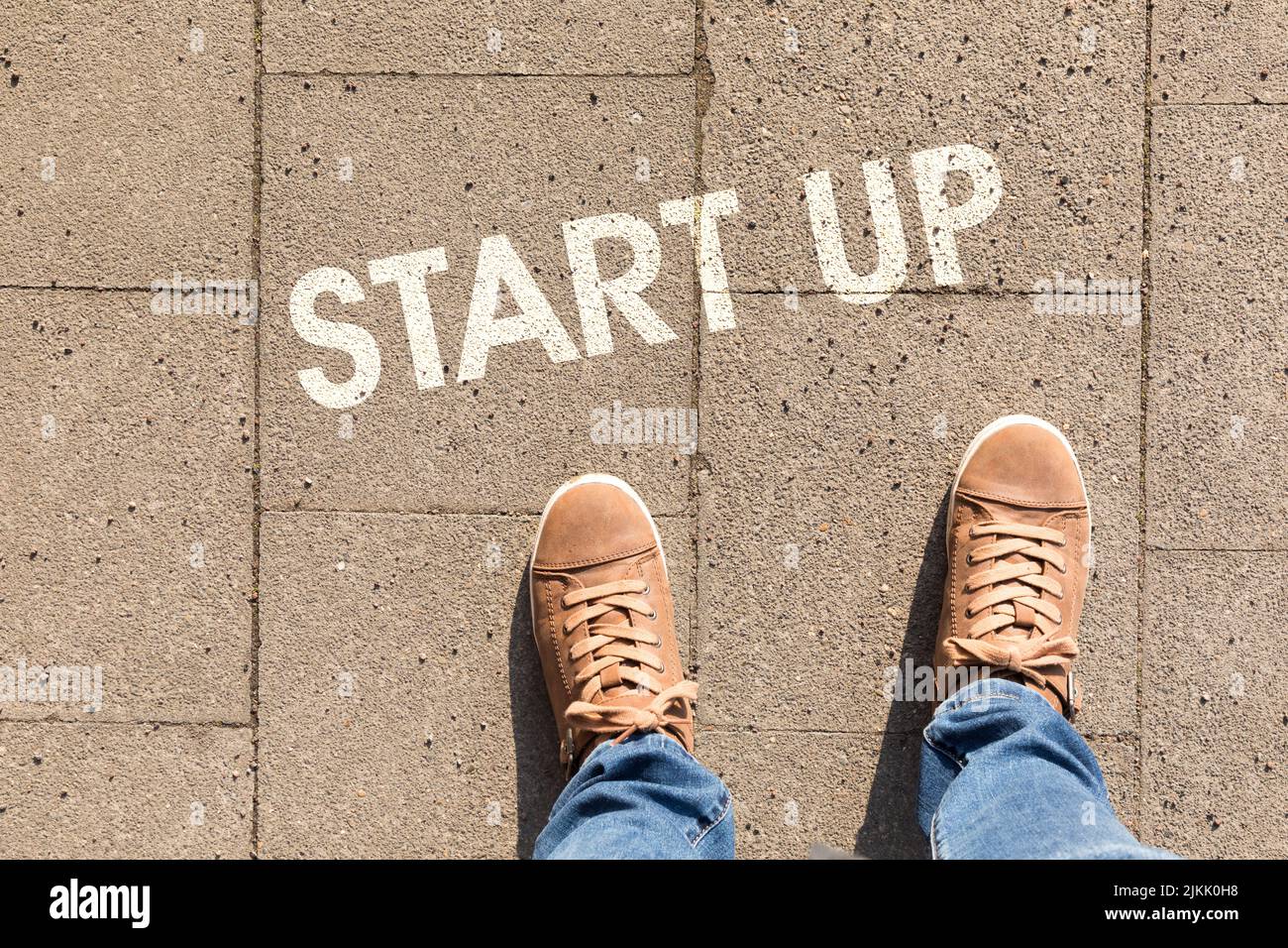 shoes with text start up Stock Photo - Alamy