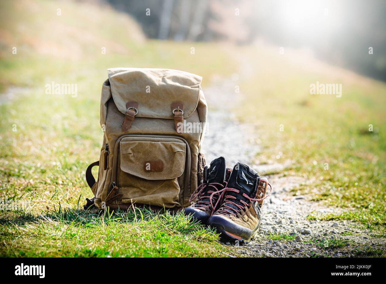 Retro backpack and hiking boots in nature. hiking gear Stock Photo - Alamy