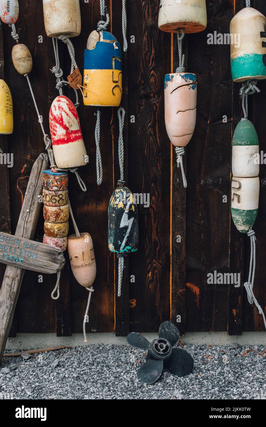 wall display of old buoys Stock Photo - Alamy