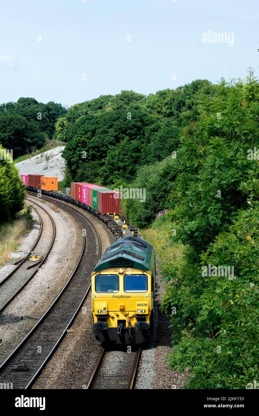 A freightliner train pulled by class 66 diesel locomotive No. 66529 ...