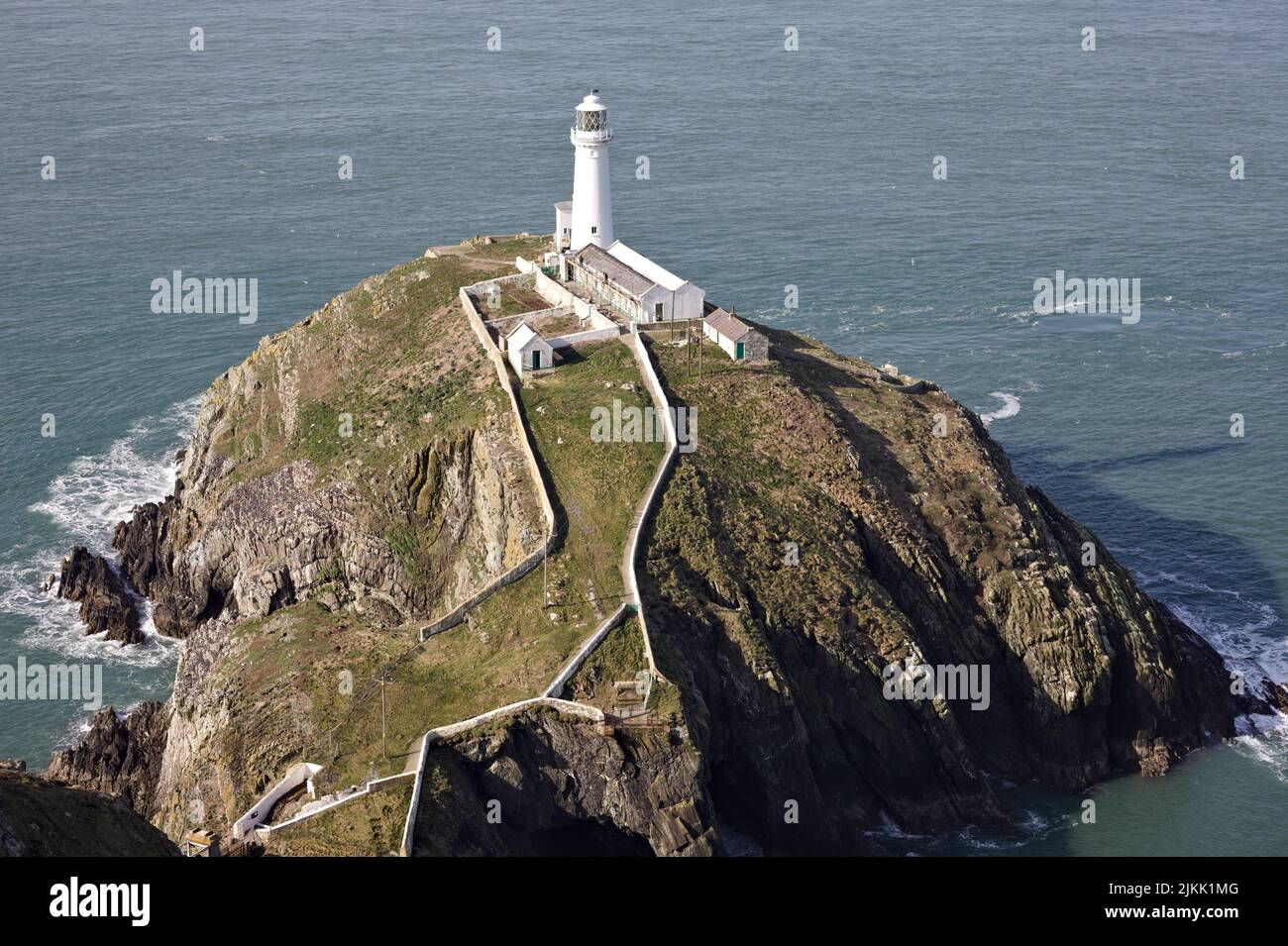 A bird's eye view of the North stack lighthouse, Anglesey, Wales on top ...