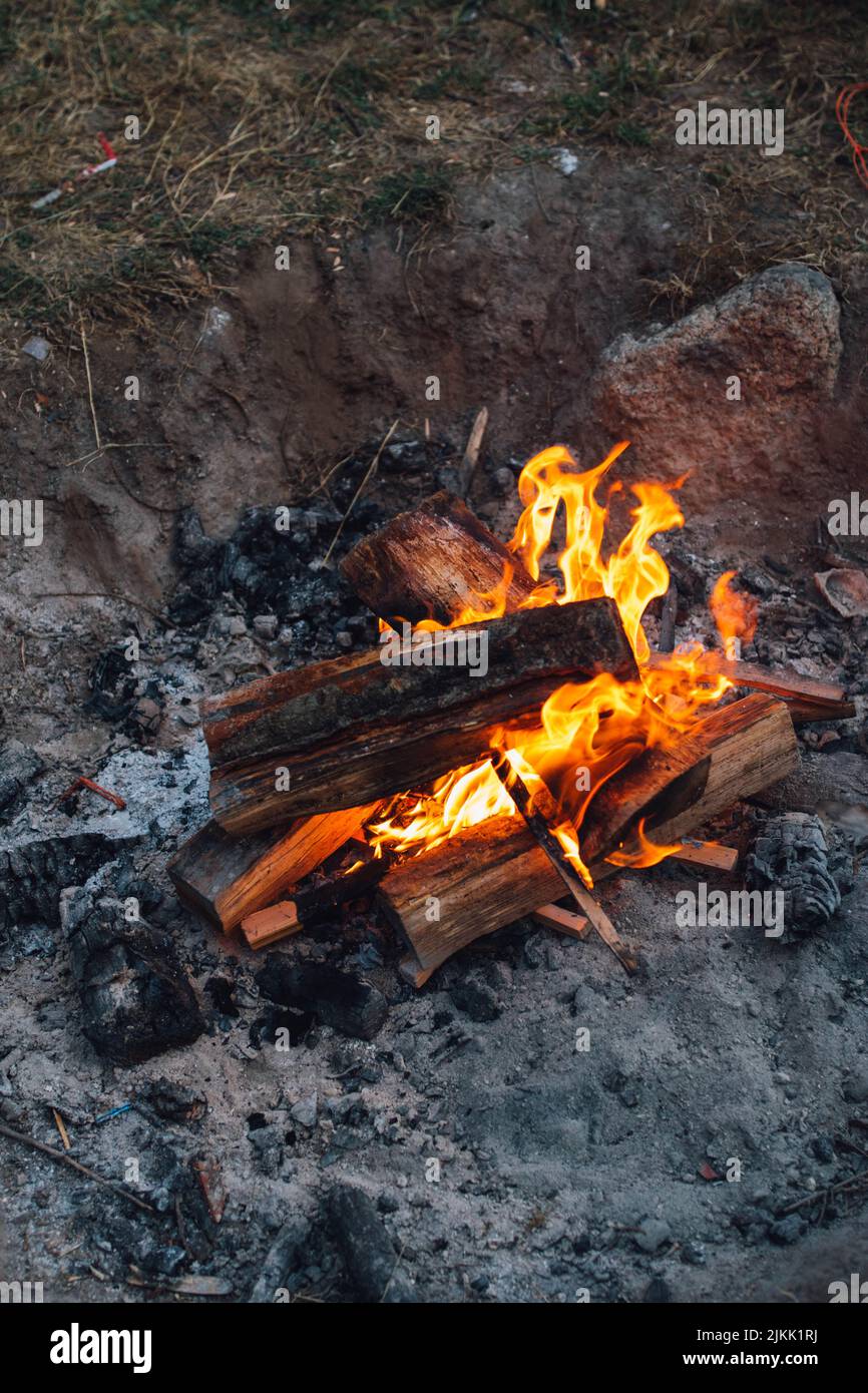 Campfire pit with flames Stock Photo - Alamy