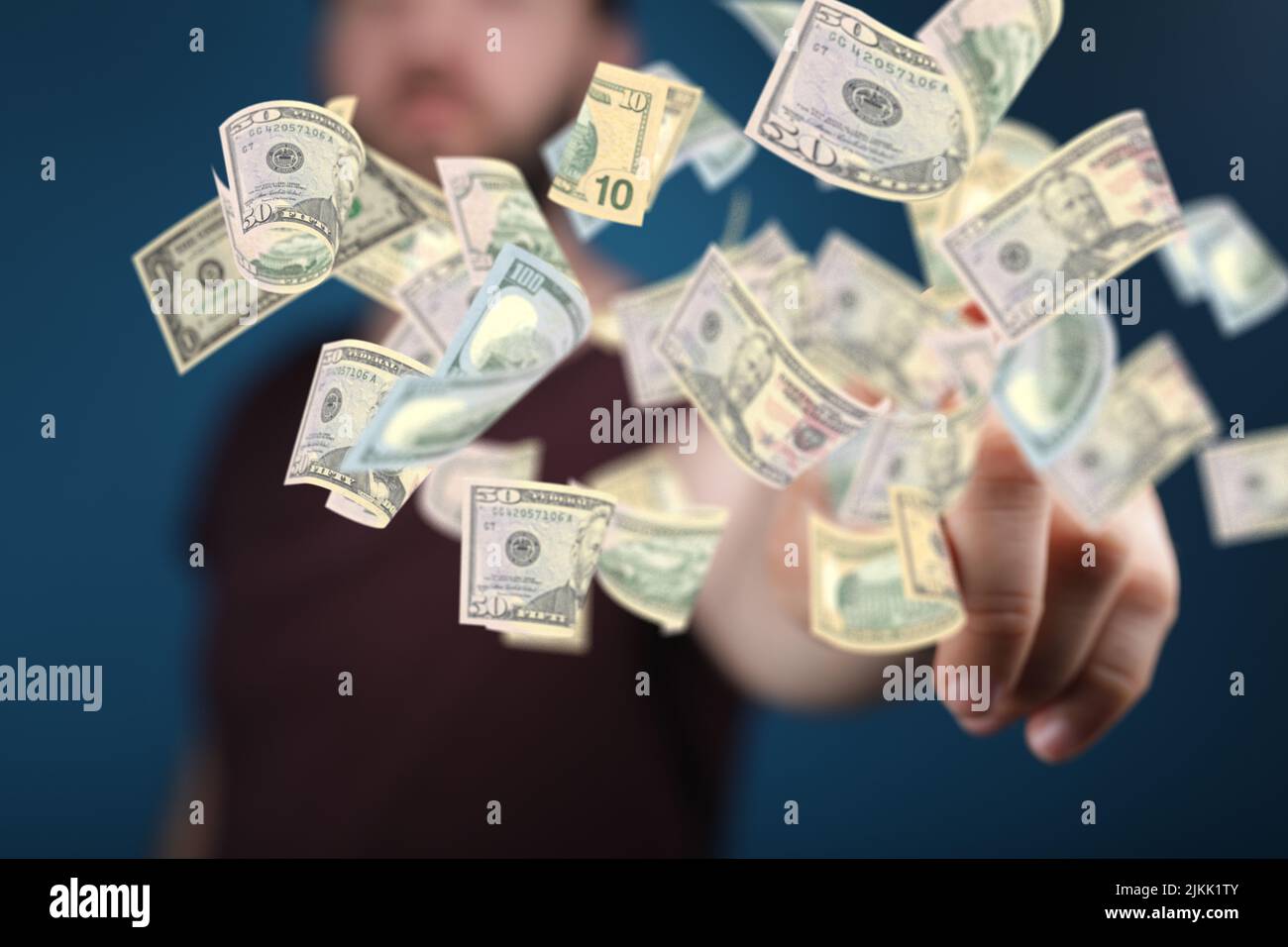 A person presenting the virtual projection of falling dollar bills ...