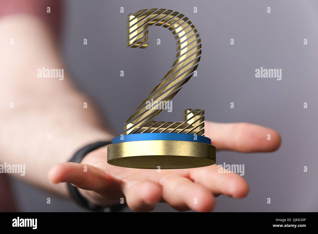A person presenting the virtual projection of a second place award ...