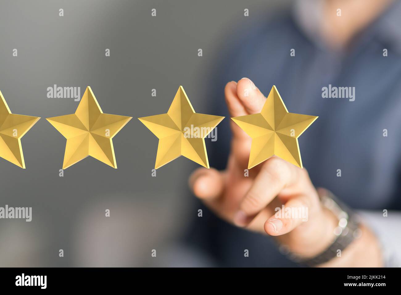 A person presenting the virtual projection of stars ranking Stock Photo ...