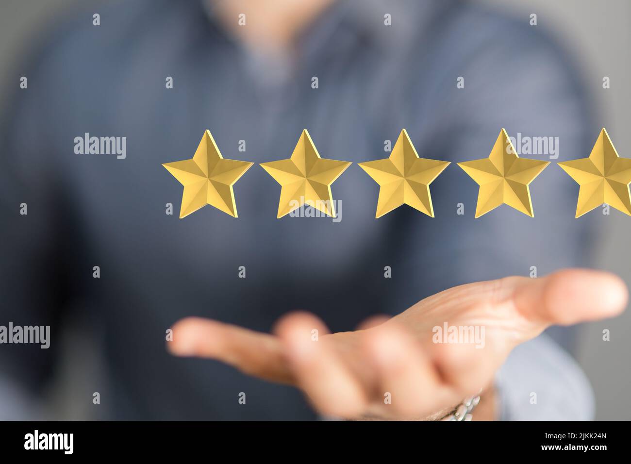 A person presenting the virtual projection of five stars ranking Stock ...