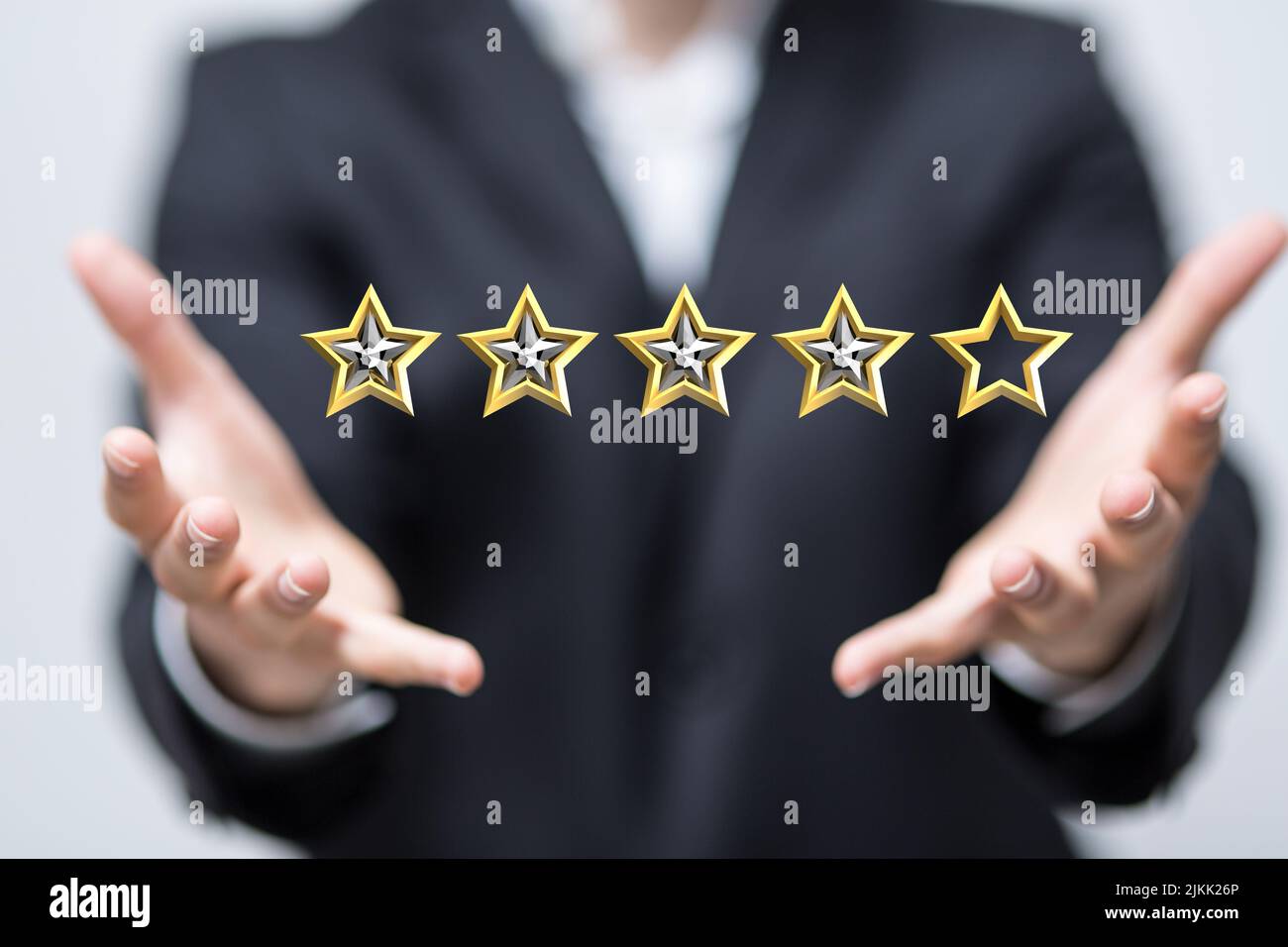 A person presenting the virtual projection of four stars ranking Stock ...
