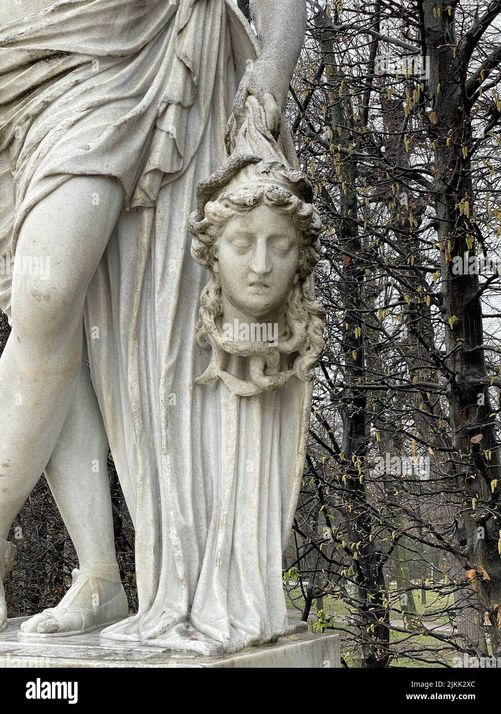 A vertical closeup shot of the cut off Medusa head Statue in ...