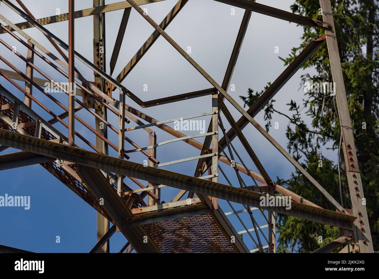 A Rusted iron railing and steps on an old forest service fire tower ...