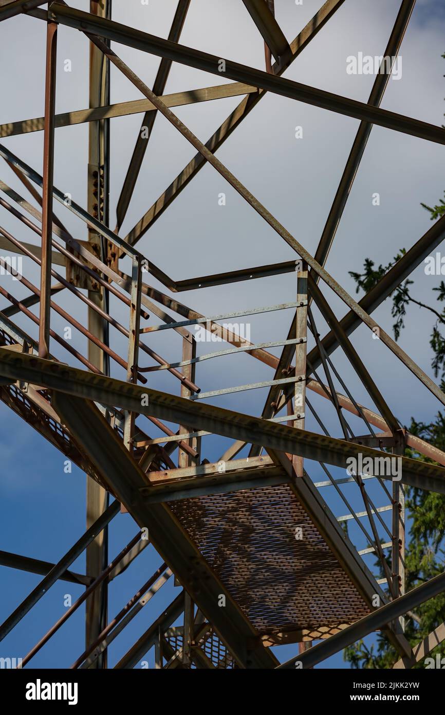 A Rusted iron railing and steps on an old forest service fire tower ...