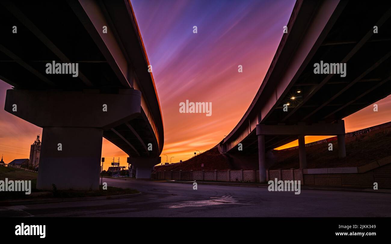 A highway overpass under the beautiful sunset sky Stock Photo - Alamy