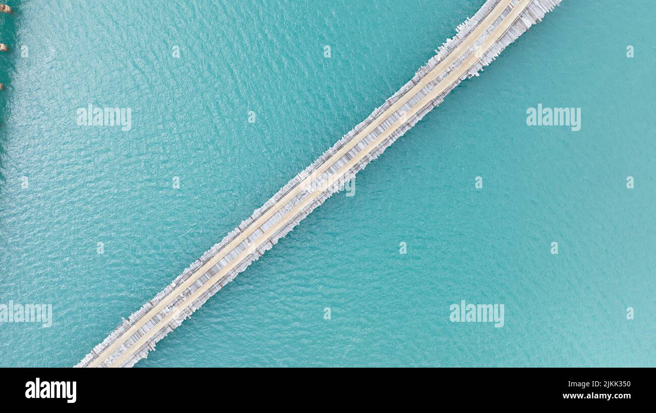 An aerial view of wooden pathway over the beautiful clear water Stock ...