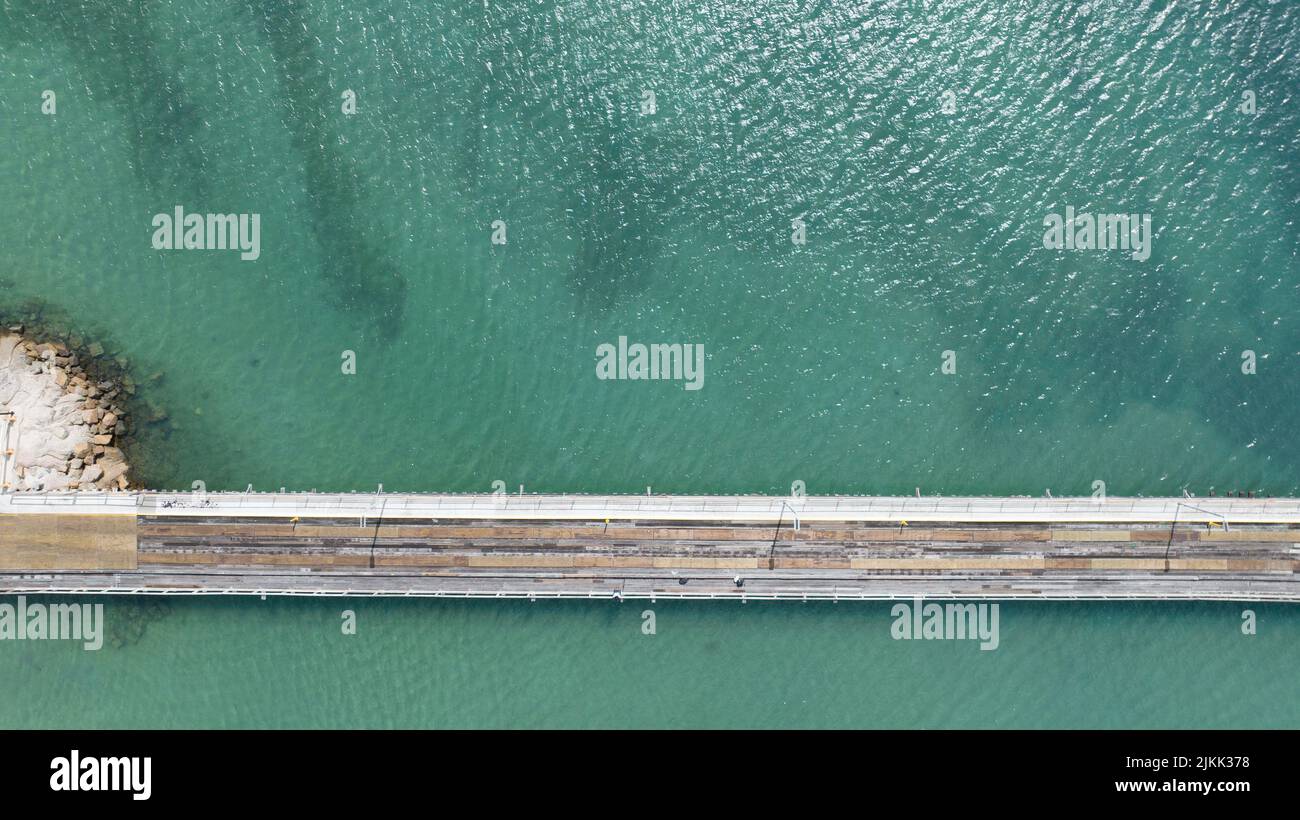 An aerial view of wooden pathway over the beautiful clear water Stock ...