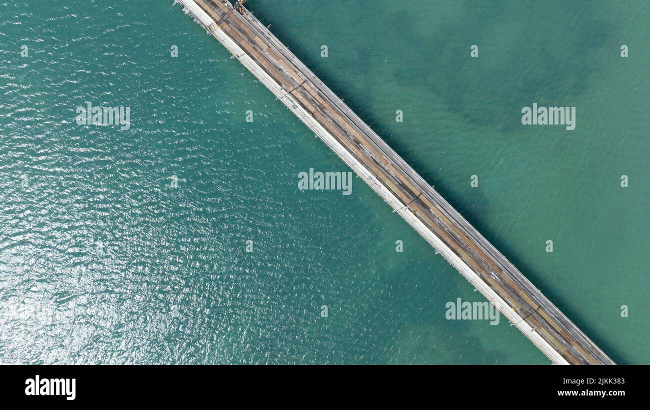 An aerial view of wooden pathway over the beautiful clear water Stock ...